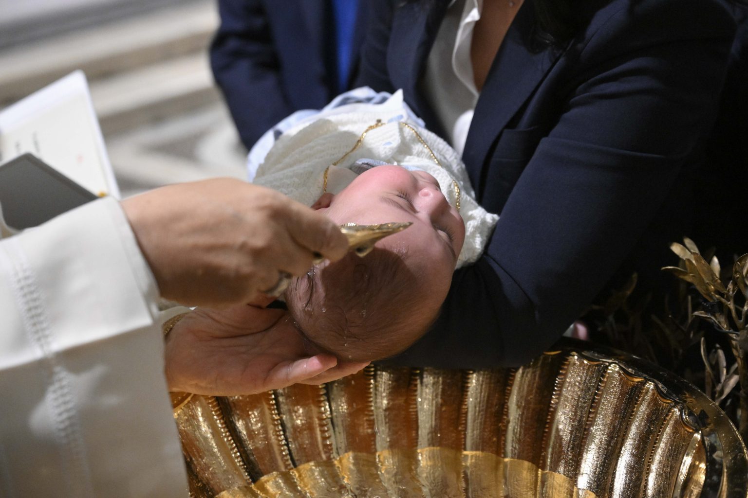 Baptism provides light in darkness, gateway to heaven, pope says ...